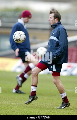 West Ham United's new signing Kevin Horlock (right) shields the ball ...