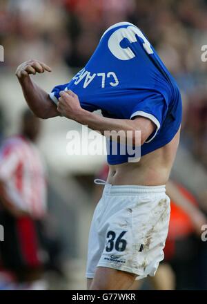Millwall's goal scorer Steve Claridge (right) leads the celebrations ...