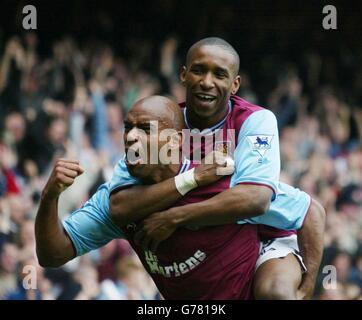 West Ham United's Trevor Sinclair rushes to congratulate Frederic ...