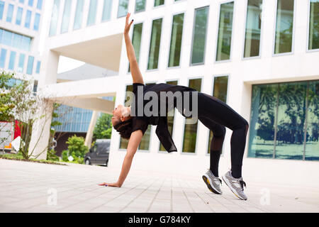 Graceful female bent jazz dancer performing and dancing with arms ...