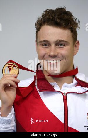 England's Oliver Hynd with his Gold medal on the podium with Silver ...