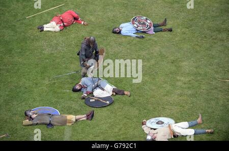 A re-enactment of a Viking attack takes place at Lindisfarne Priory ...
