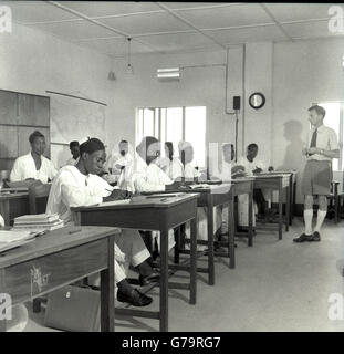 1950s, historical, school classroom, male teacher in traditional gown ...