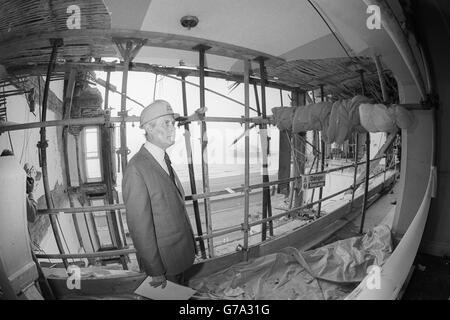 Architects' Administrator Derek Allen stands in the remains of the ...