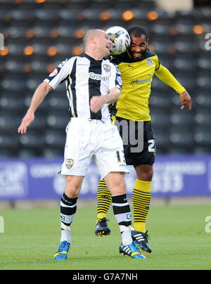 Notts County's Gary Jones (left) and Coventry City's Grant Ward battle ...