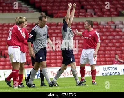Nottingham Forest players protest as Mark Rivers (R) celebrates his ...