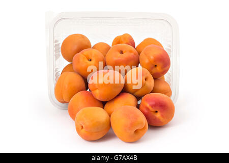 Box or punnet and spilled fresh ripe organic nectarines isolated on ...