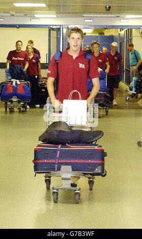 British Olympic swimmer David Davies shows off his bronze medal won in ...