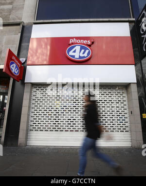 A Phones 4U shop in Oxford Street in central London with its shutters down as more than 500 of ...