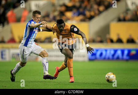 Jonathan Hogg of Huddersfield Town holds Louis Thompson of Stevenage ...
