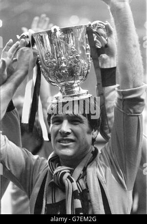 (L-R) Wolverhampton Wanderers captain Emlyn Hughes lifts the League Cup ...