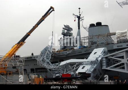The arm of a 210ft crane rests on the side of the Royal Navy Aircraft ...
