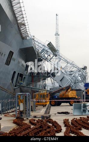 The arm of a 210ft crane rests on the side of the Royal Navy Aircraft ...