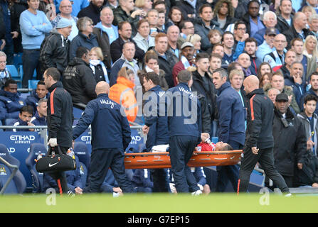 Injured football player on a stretcher Stock Photo - Alamy