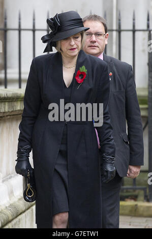 Theresa May walks through Downing Street to attend the Remembrance ...
