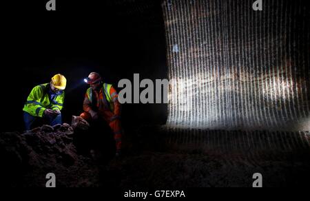 Miners work at the salt face, 500ft below the surface at the Compass ...