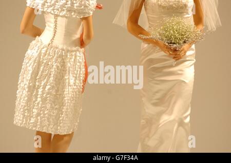 Two models wear creations by fashion designer Arkadius at the Natural ...