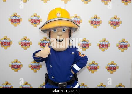 An actor dressed as Fireman Sam at the Brockwell Park fireworks display ...
