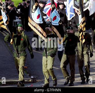 Masked members of the Ulster Defence Association (UDA) on parade in ...