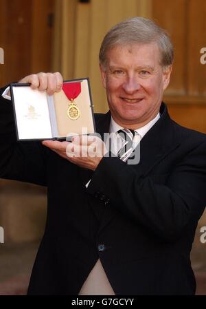 Chris Maccabe smiles proudly as he holds his Honourable Order of the ...