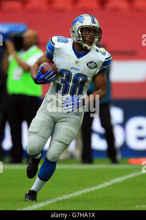 Detroit Lions running back George Winn (38) jumps over Jacksonville ...