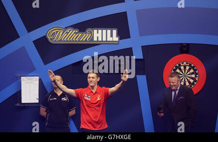 David Pallett waves to the crowd as he walks on for his match against ...