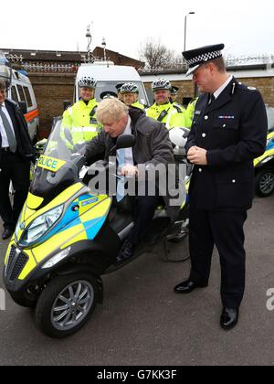 Motorcycle officers from the London Police Service stand along the ...