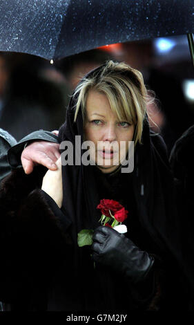 Champion Irish Showjumber Paul Darragh's wife Jane (centre) is consoled ...