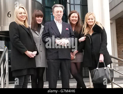 Paul Kohler, 55, stands with his family, (left to right) wife Samantha ...