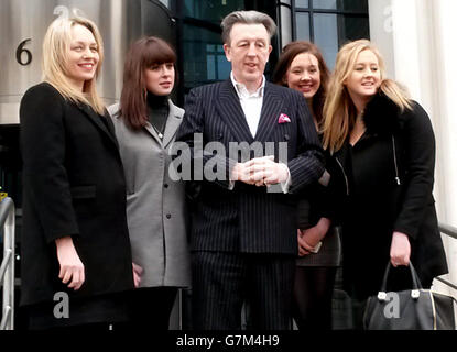 Paul Kohler, 55, stands with his family, (left to right) wife Samantha ...