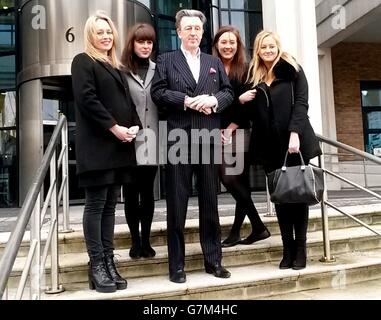 Paul Kohler, 55, stands with his family, (left to right) wife Samantha ...
