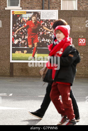 Liverpool fans make their way to Anfield during the Premier League ...