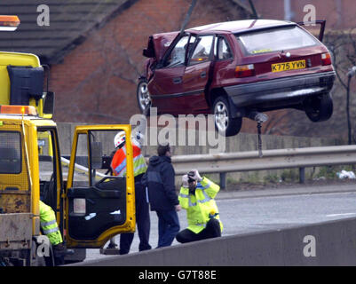 A Vauxhall Astra car is removed from the westlink. Two people were in ...