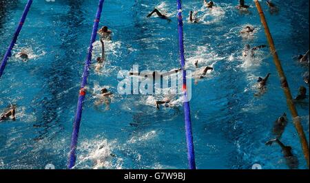 The competitors warm up in the pool before the start of the morning ...