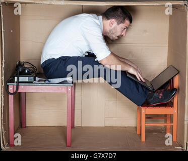 strange position at the desk Stock Photo - Alamy