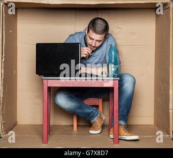 The young man student drunk drinking alcohol in a messy room Stock ...
