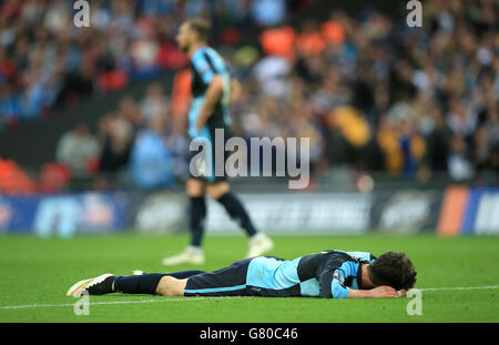 Joe Jacobson of Wycombe Wanderers on the ball taking on Ben Thompson of ...