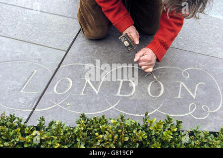 British artist and sculptor Simon Verity demonstrating his stone ...