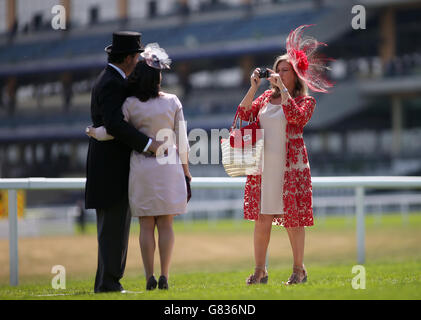 Racegoers pose for a photograph on Ladies Day of the Debenhams July ...