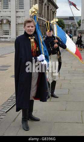 Actor Julian Farrance dressed as Major Henry Percy carries a replica ...