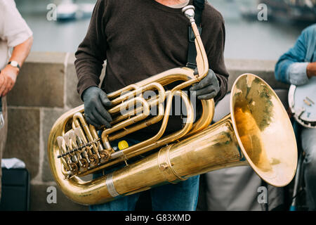 Street Busker performing jazz songs outdoors. Close up of musical ...