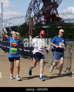 Competitors take part in the Morrison's Great Newham London Run, Queen ...