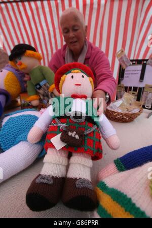 Audrey Sherwin at a stall with knitted woollen jockeys as sheep prepare ...