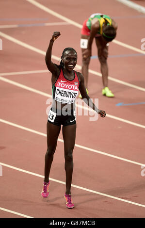 Kenya's Vivian Jepkemoi Cheruiyot, left, celebrates crossing the finish ...