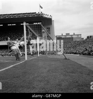 Nottingham Forest goalkeeper Peter Grummitt (l) saves a shot from ...