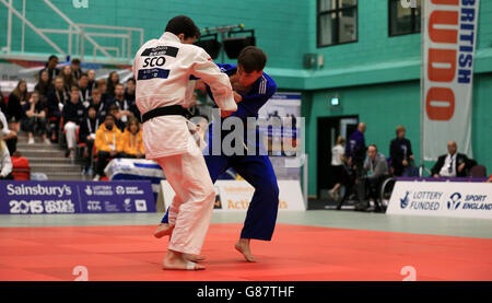 Scotland's Harry Mustard (blue) and Wales' Iwan Cavil (blue) compete in ...