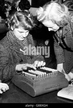 Girl using adding machine Stock Photo - Alamy