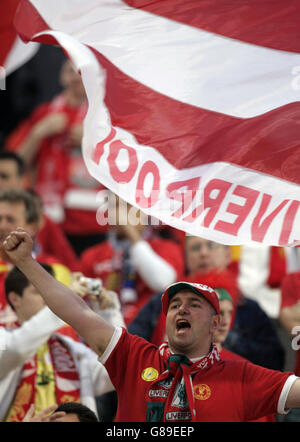 Liverpool fans cheer for their team before the start of the English ...