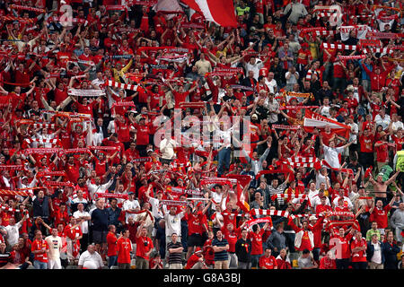 Liverpool fans cheer on their team ahead of the Premier League match at ...