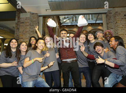 Sam Shaikh, 29, from Stratford, celebrates with staff after he was the ...